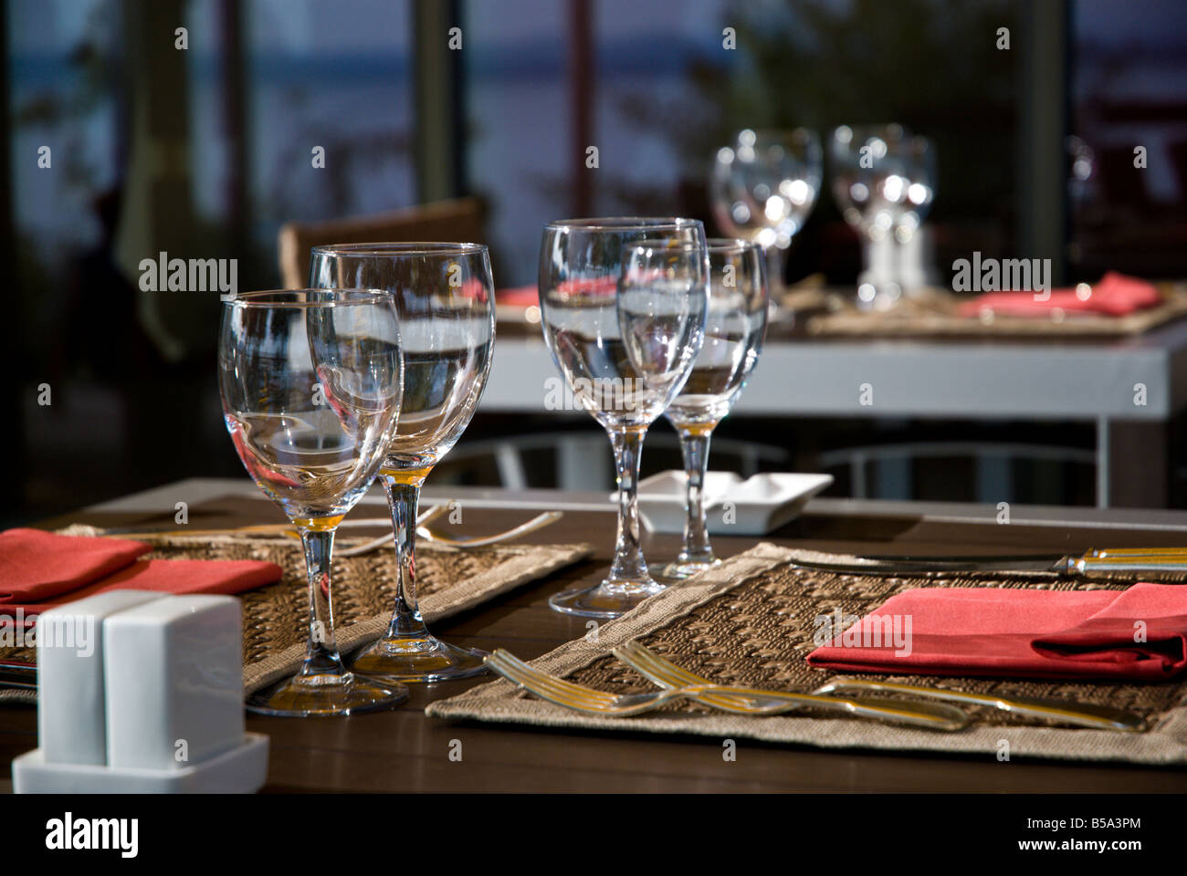 Table setting, wine glasses, water glasses on outdoor dining terrace ... Table setting, wine glasses, water glasses on outdoor dining terrace ...