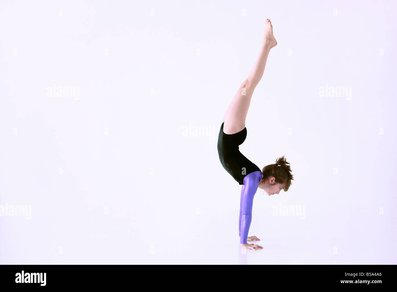 Girl doing handstand Stock Photo - Alamy