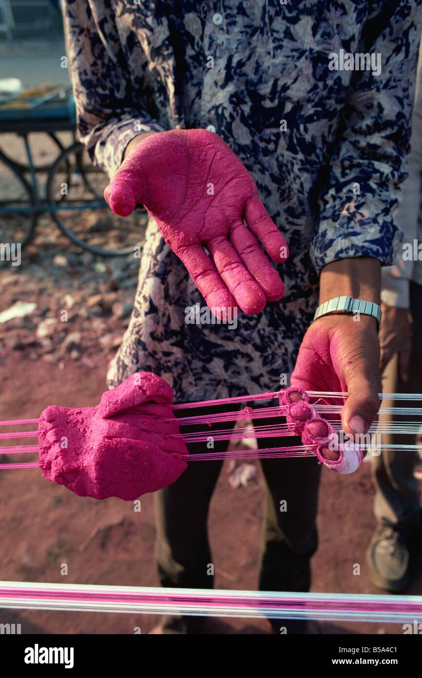Kite string production, string is coated in ground glass for fighting ...