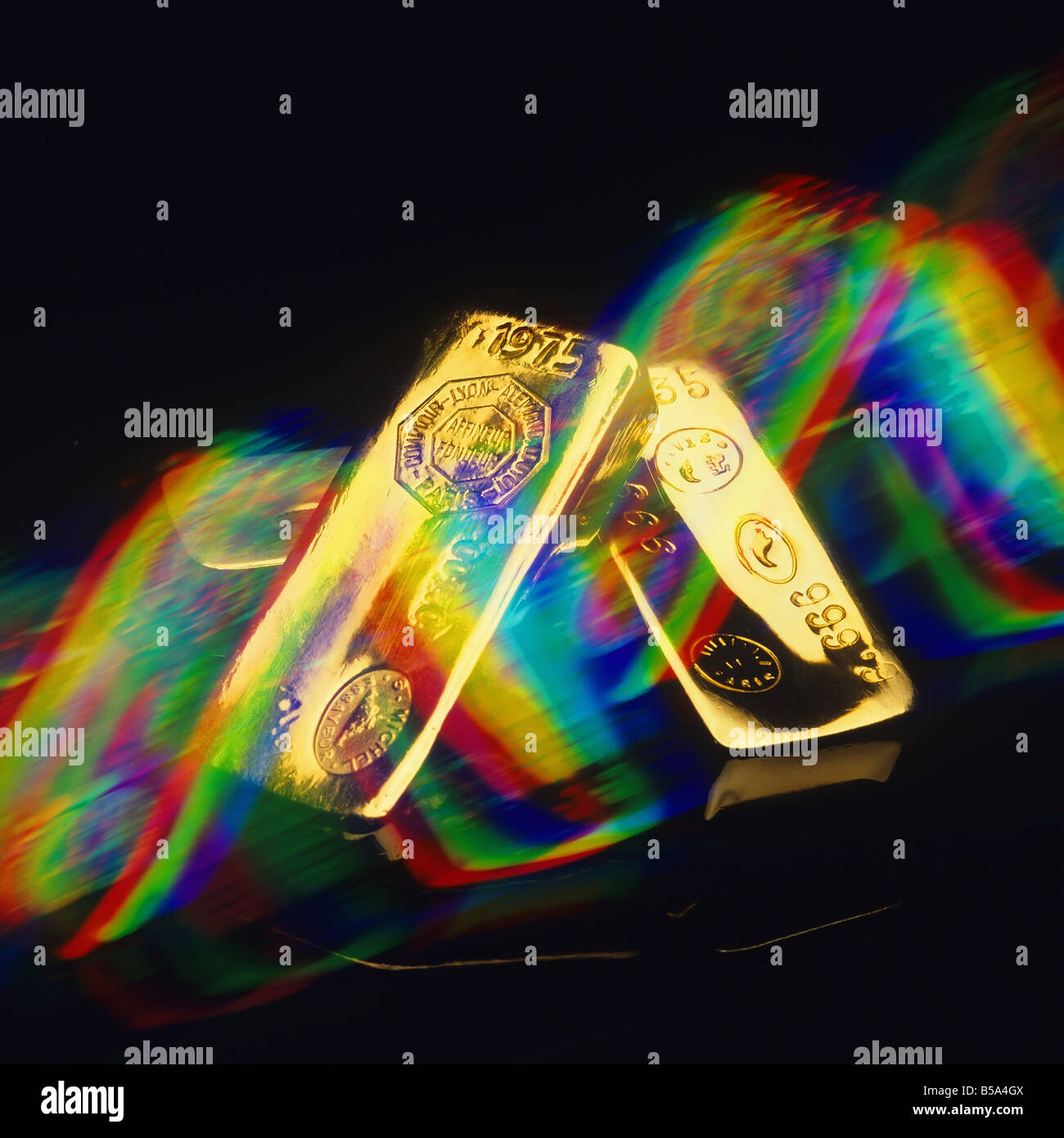 Multiple image of 2 gold bars with coloured lighting Stock Photo - Alamy