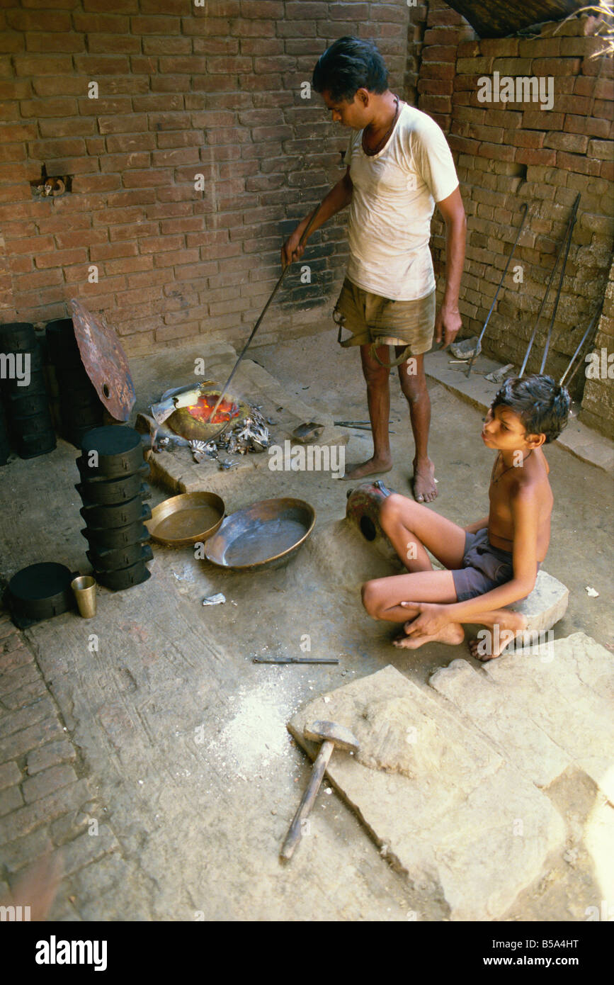 Preparation of molten brass in brass moulding workshop India Asia Stock ...