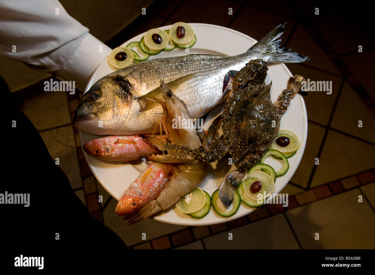 Local fish served in restaurant hi-res stock photography and images - Alamy