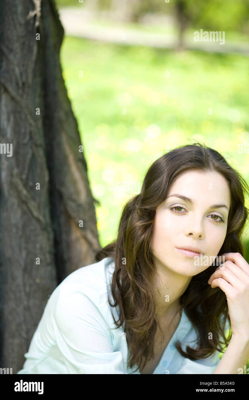 young woman relaxing under tree Stock Photo - Alamy young woman relaxing under tree Stock Photo - Alamy