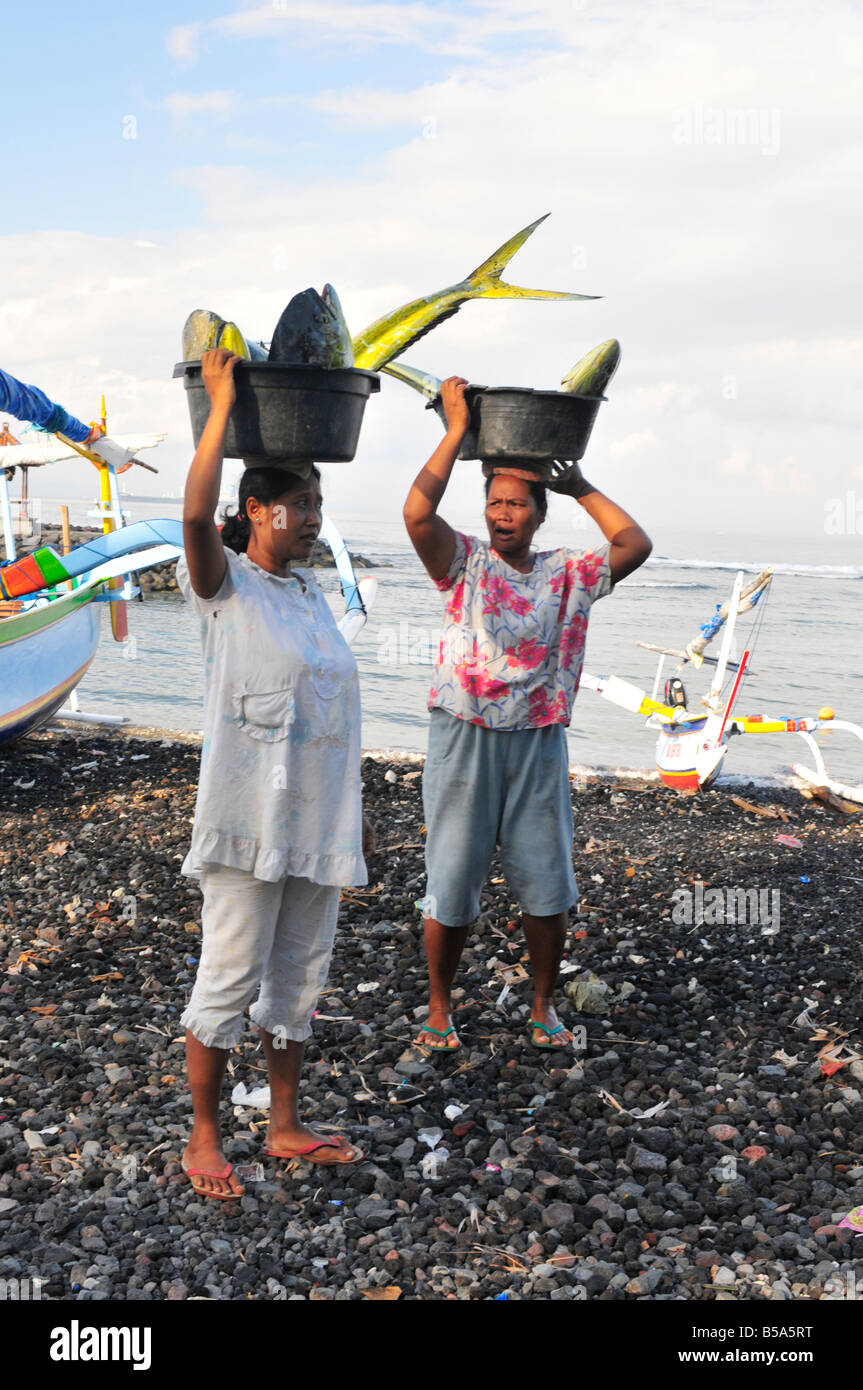 Balinese women carrying Mahi Mahi fish on their head,Candidasa,Bali ...