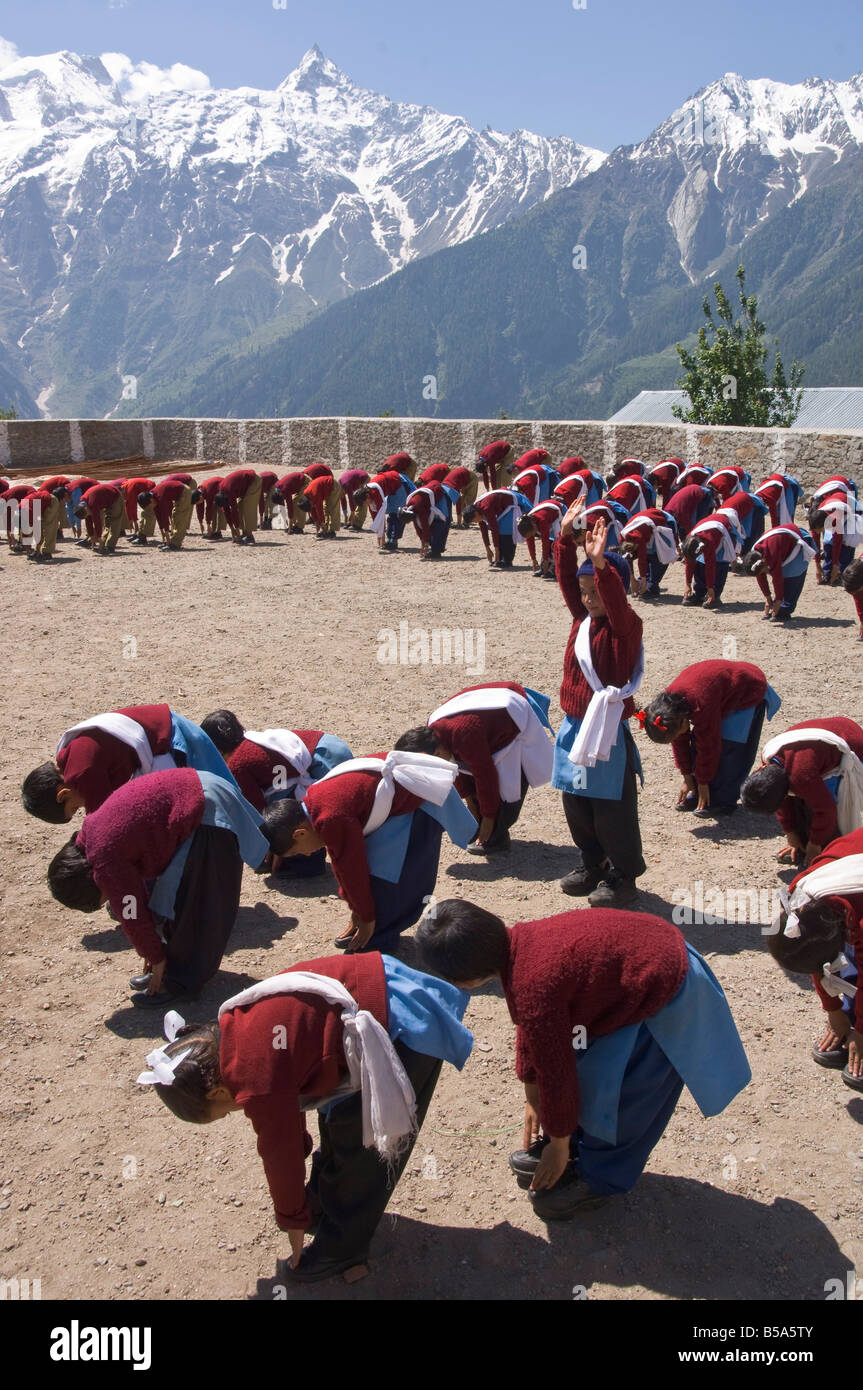 School children during morning physical training in school courtyard ...