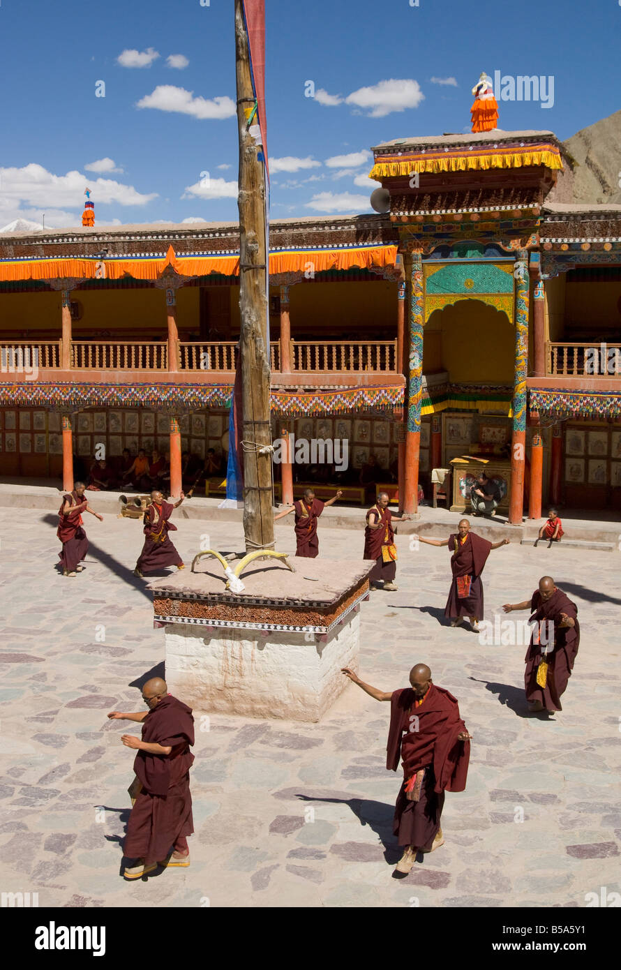 Group of monks dancing in the monastery courtyard rehearsing for Hemis ...