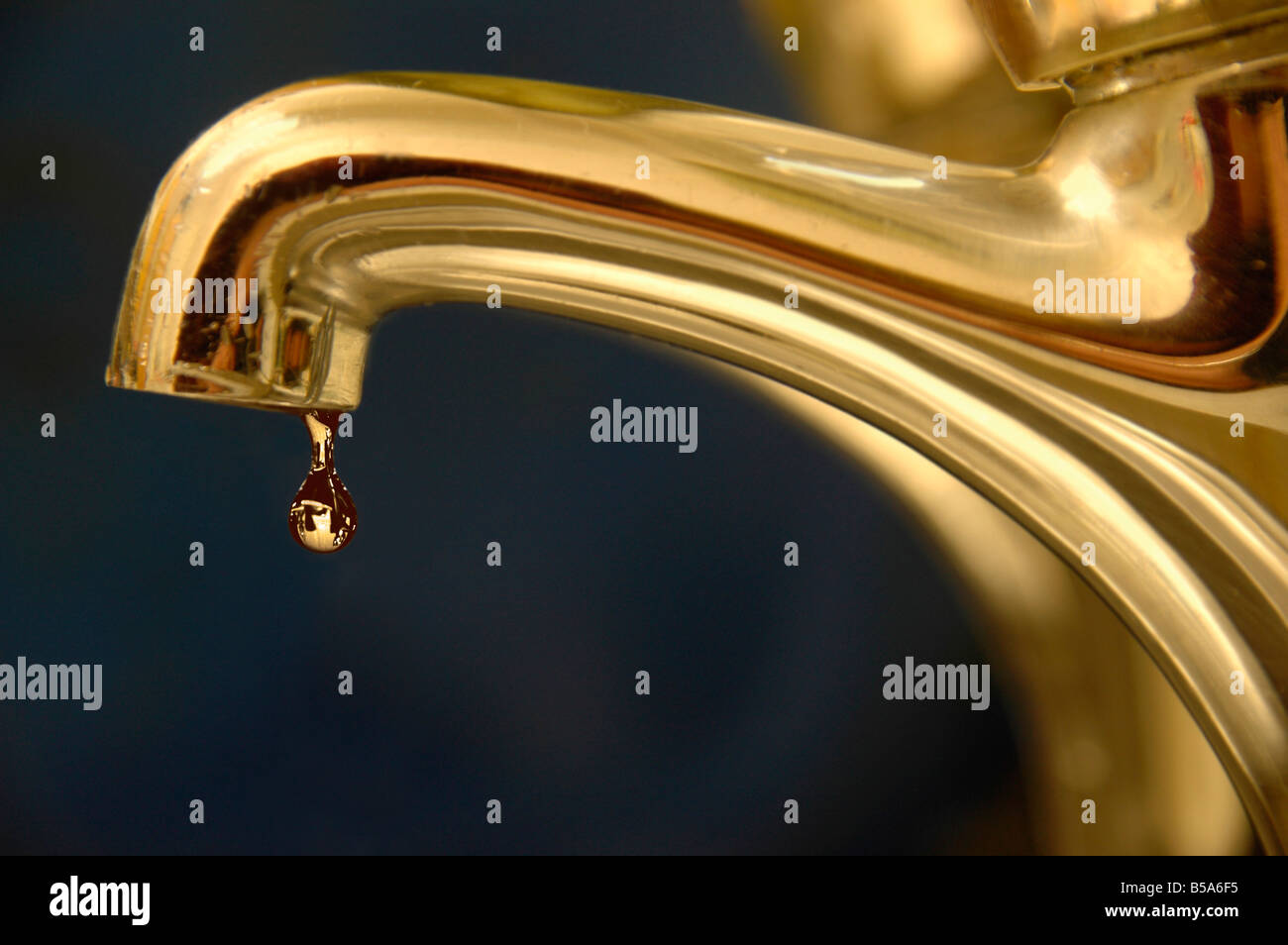 A drop of water drips from a tap Stock Photo - Alamy