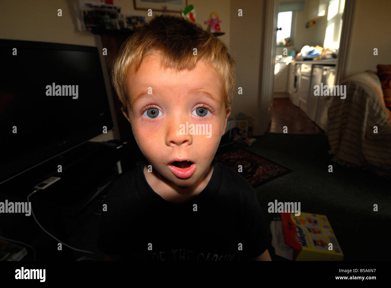 Young boy with shocked expression Stock Photo - Alamy