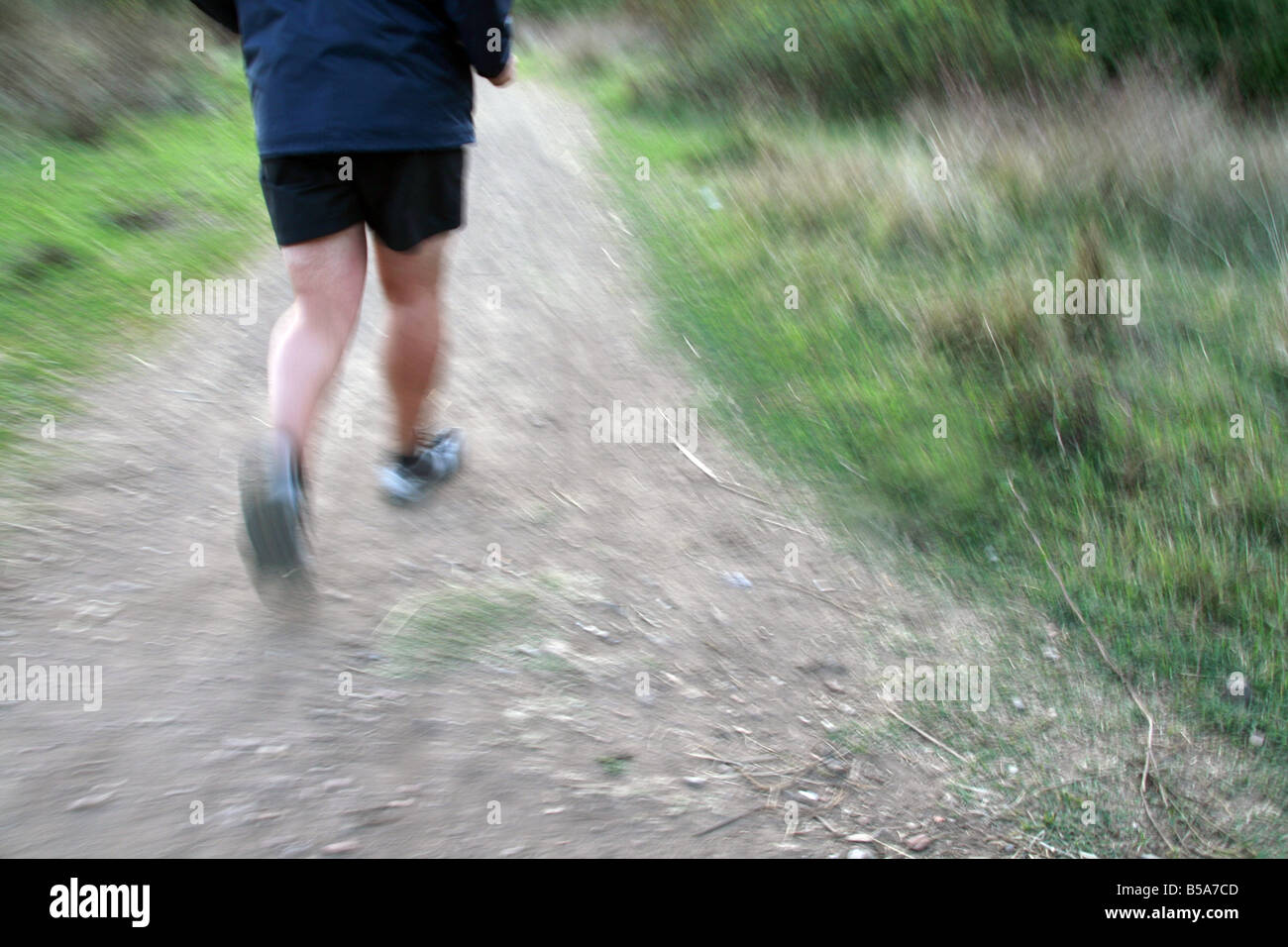 fast overweight man runner on country lane Stock Photo - Alamy