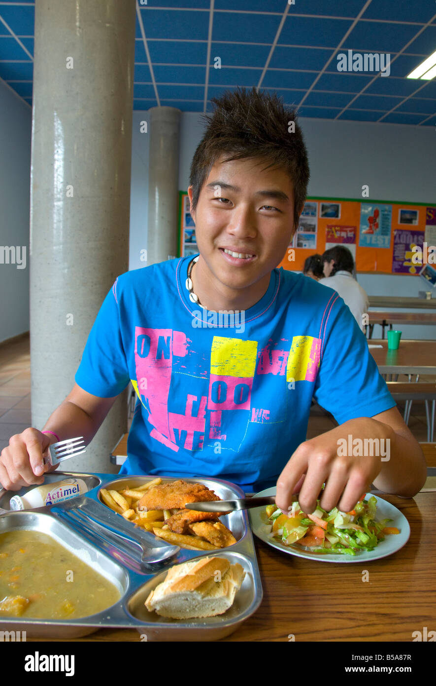 SCHOOL CANTEEN senior school boy Korean Far Eastern; student having ...