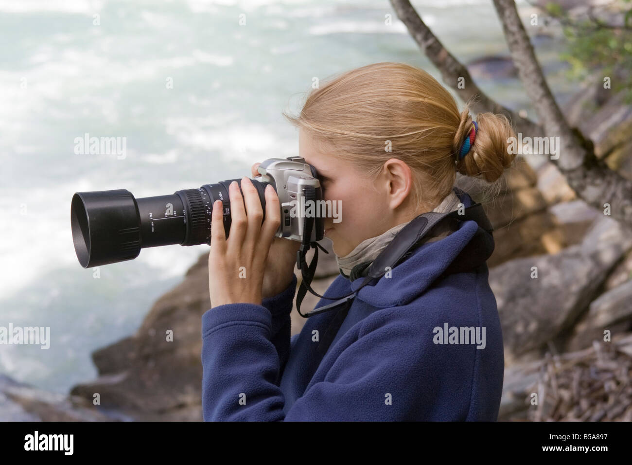 Young photographer with telephoto lens Fraser River Rearguard Falls ...
