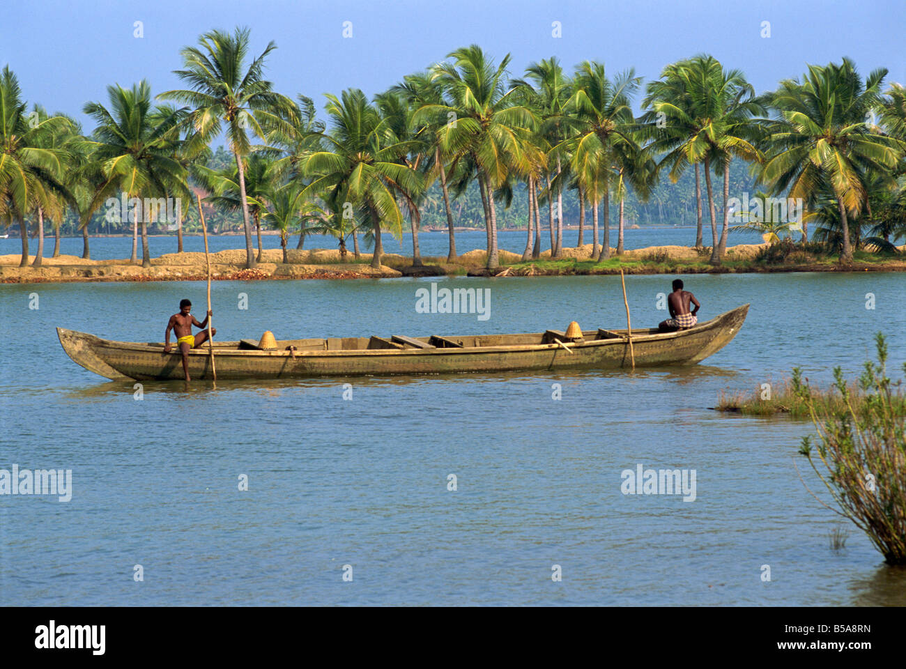 Collecting sand for building in the Backwaters, Kerala state, India ...