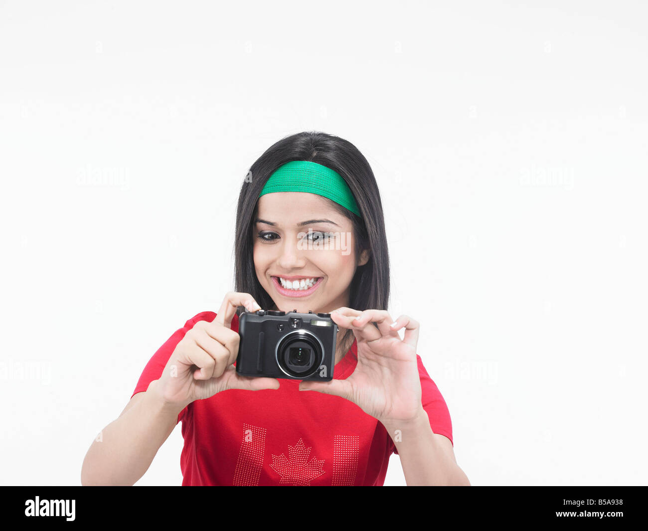 a pretty asian woman with a hot shot camera talking picture Stock Photo ...