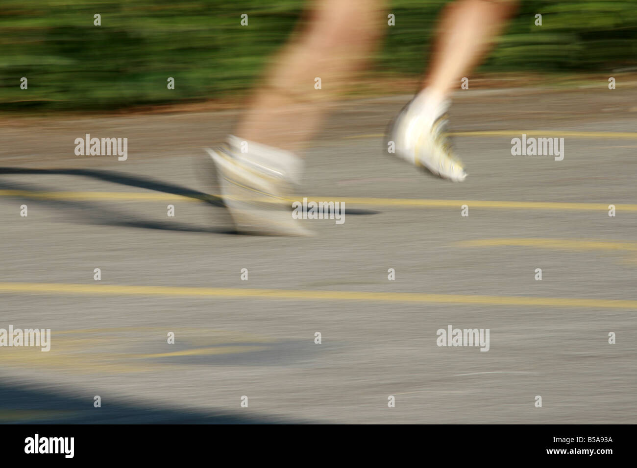abstract feet of fast runner in park Stock Photo - Alamy