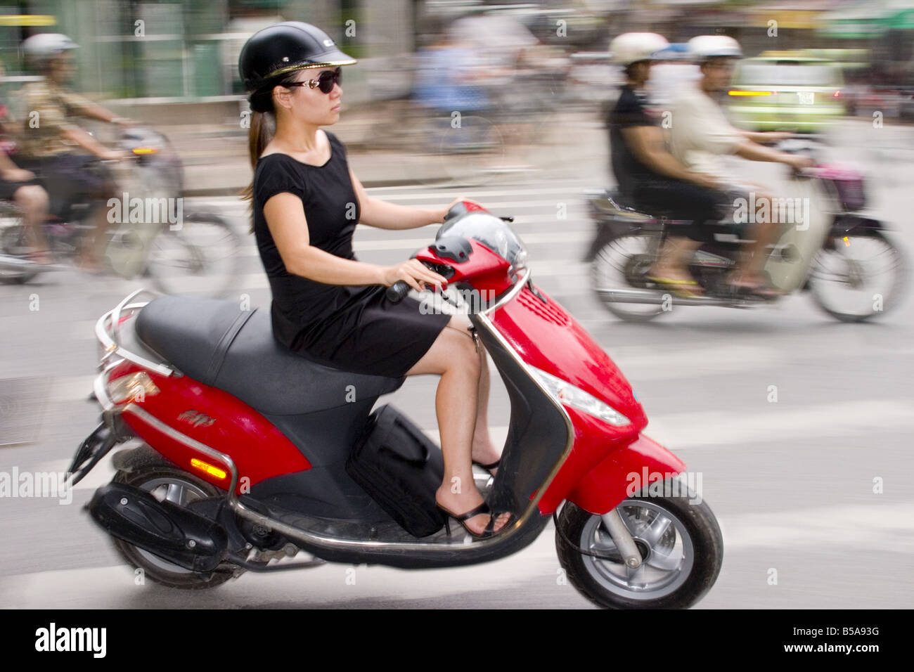 Smart young Vietnamese woman on motor scooter, Hanoi, Vietnam Stock ...