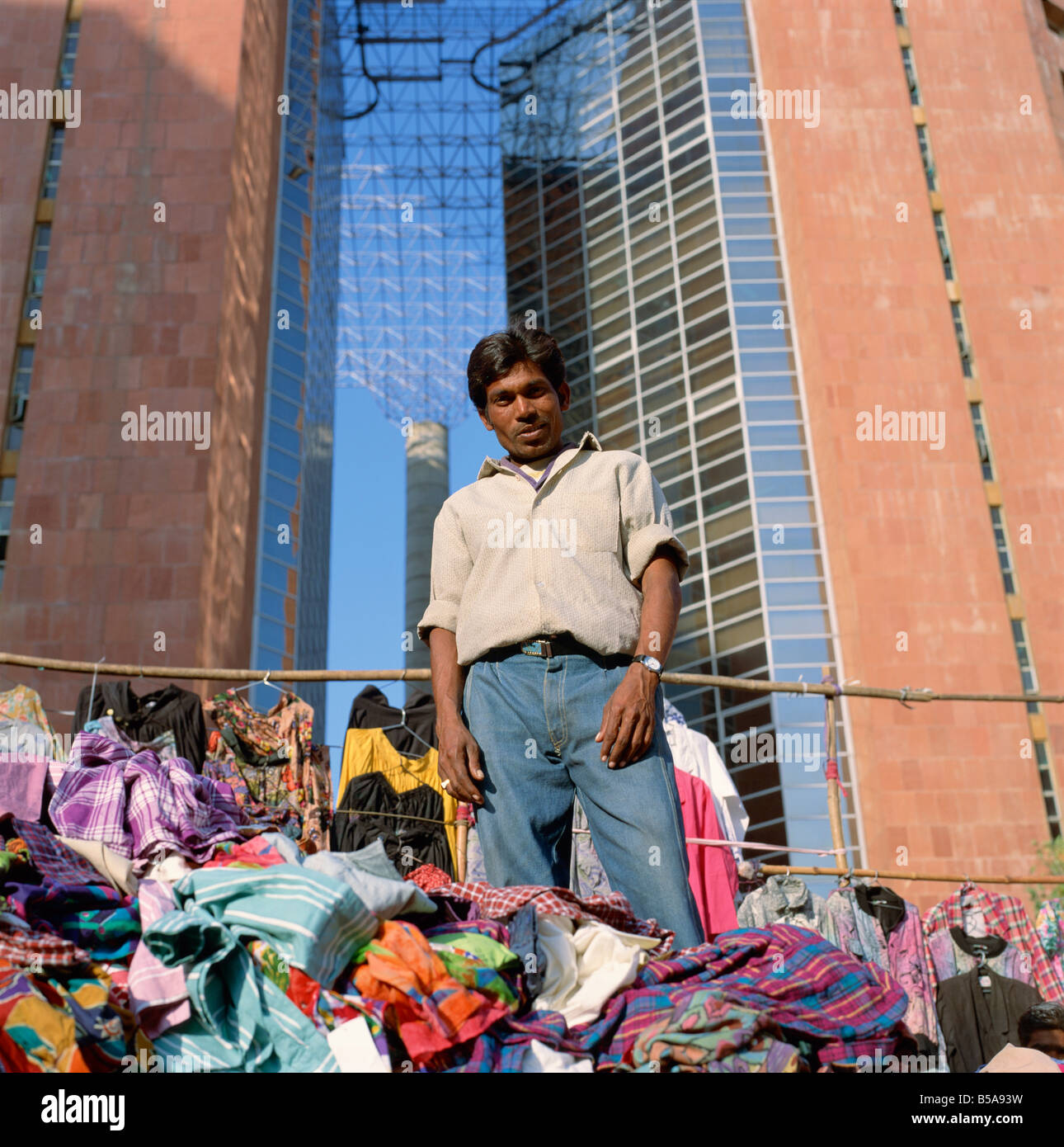 Portrait of market trader selling clothing Delhi India T Gervis Stock ...