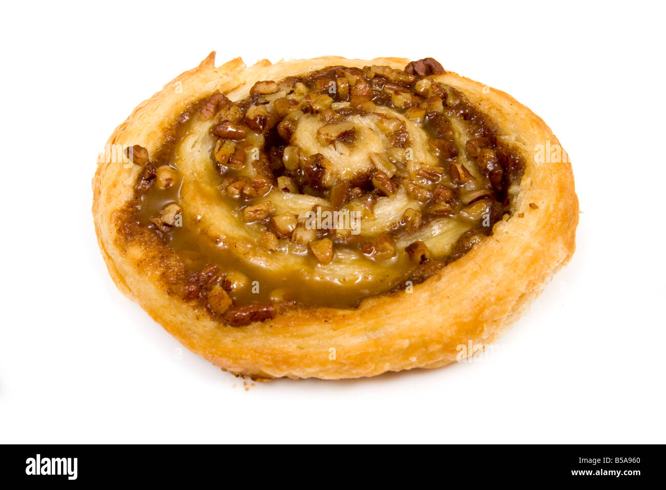 Toffee pecan twirl isolated on a white studio background Stock Photo ...