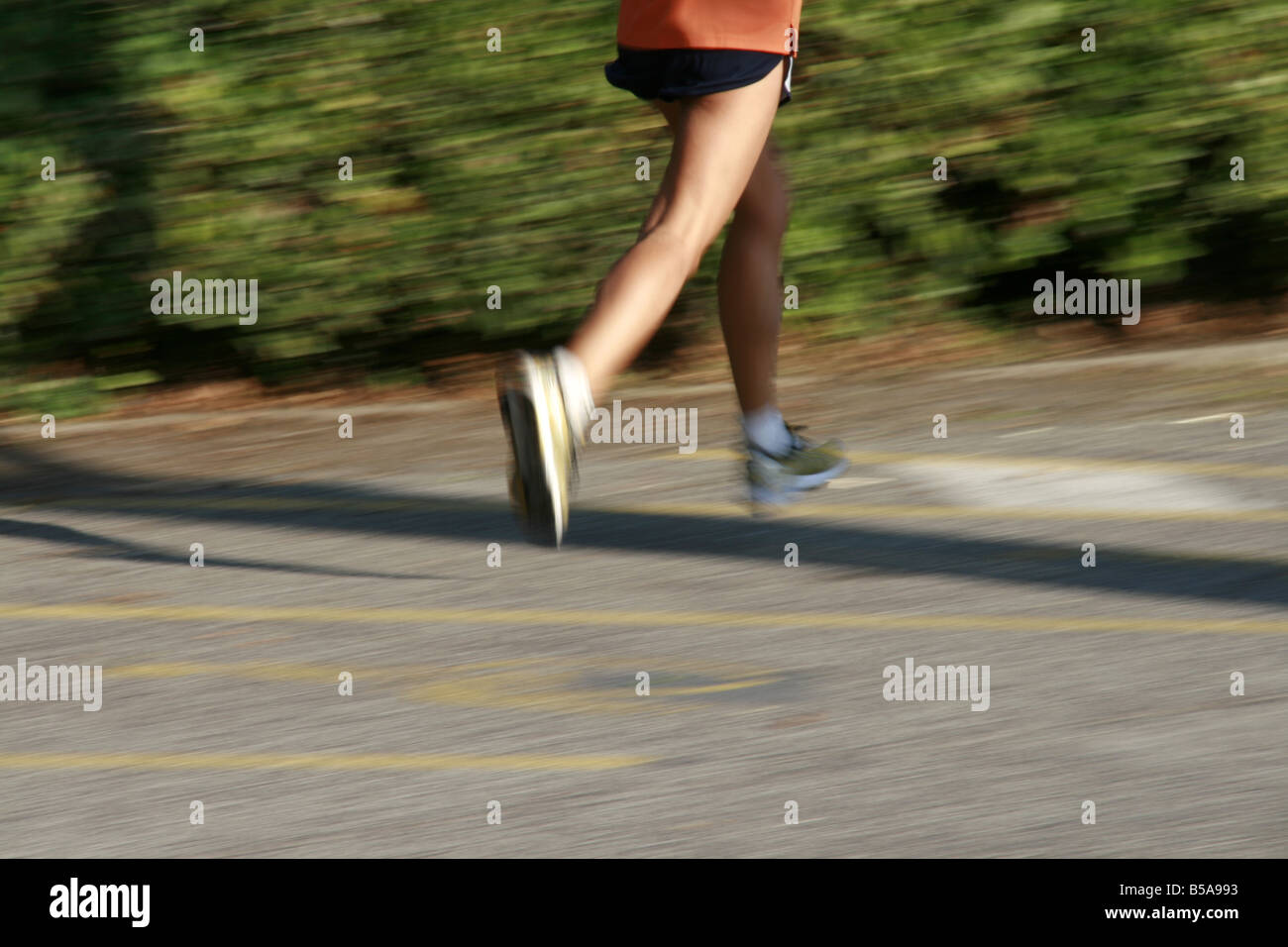 abstract feet of fast runner in park Stock Photo - Alamy