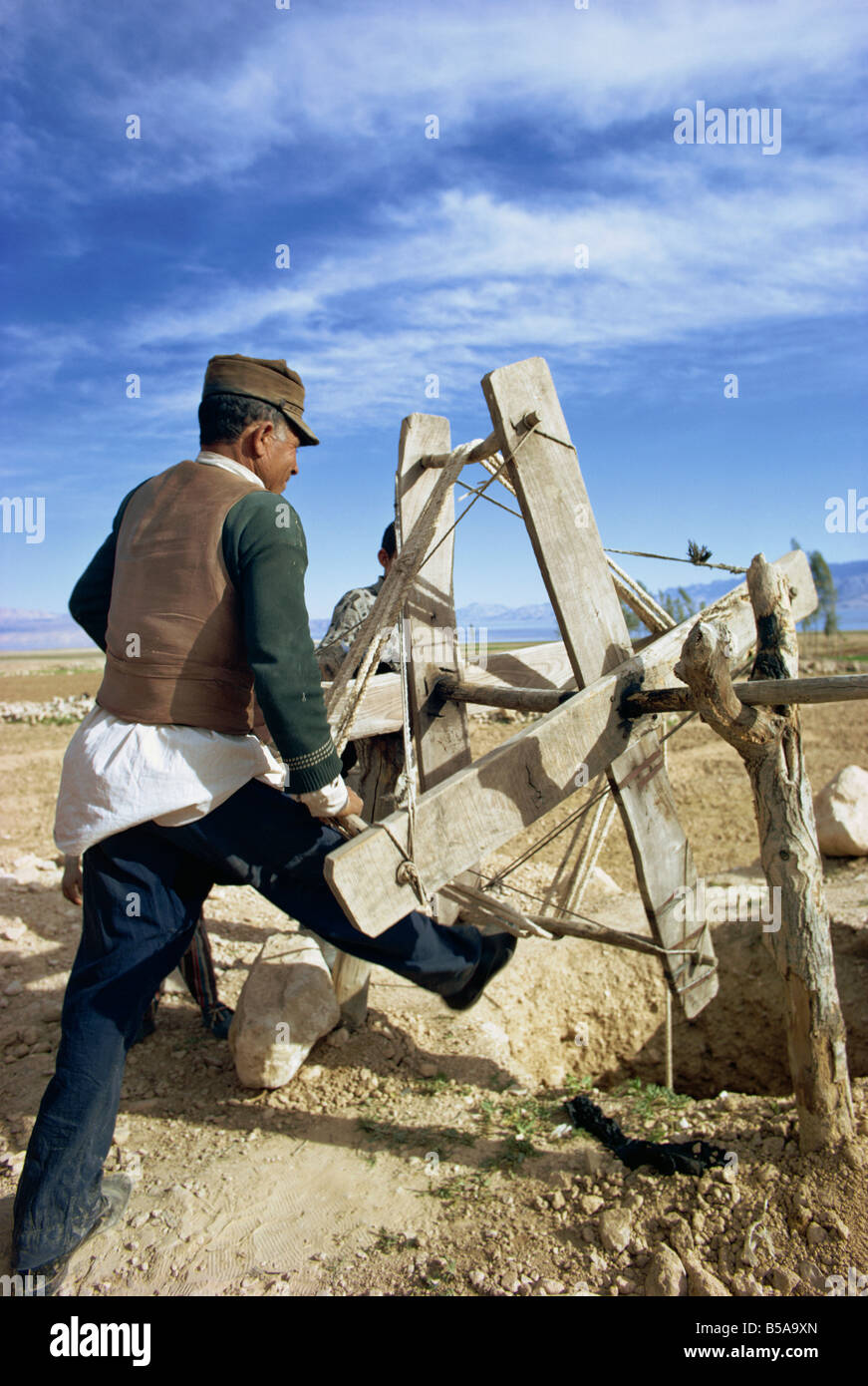 Man using a winding machine to get water from well kanat qanat ...