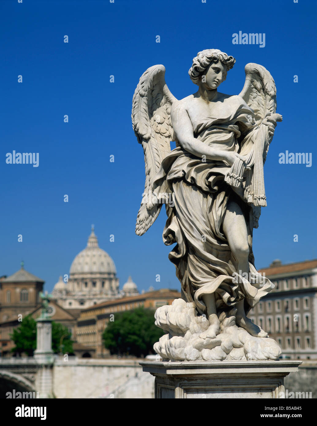 Statue of an angel in front of the dome of St Peters in Rome Lazio ...