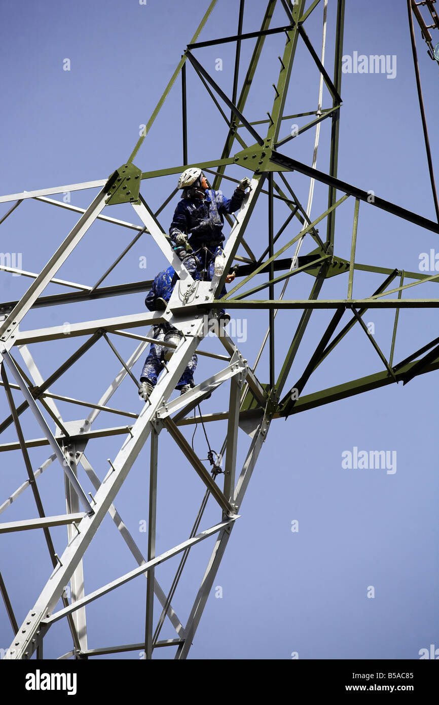 Workers maintaining the transmission line Stock Photo - Alamy