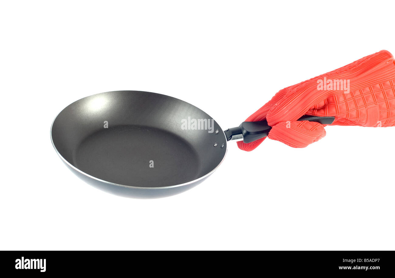 object on white griddle with hand Stock Photo - Alamy