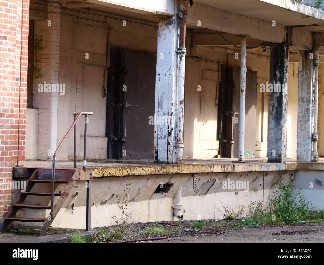 Loading bay of an old derelict factory Stock Photo - Alamy