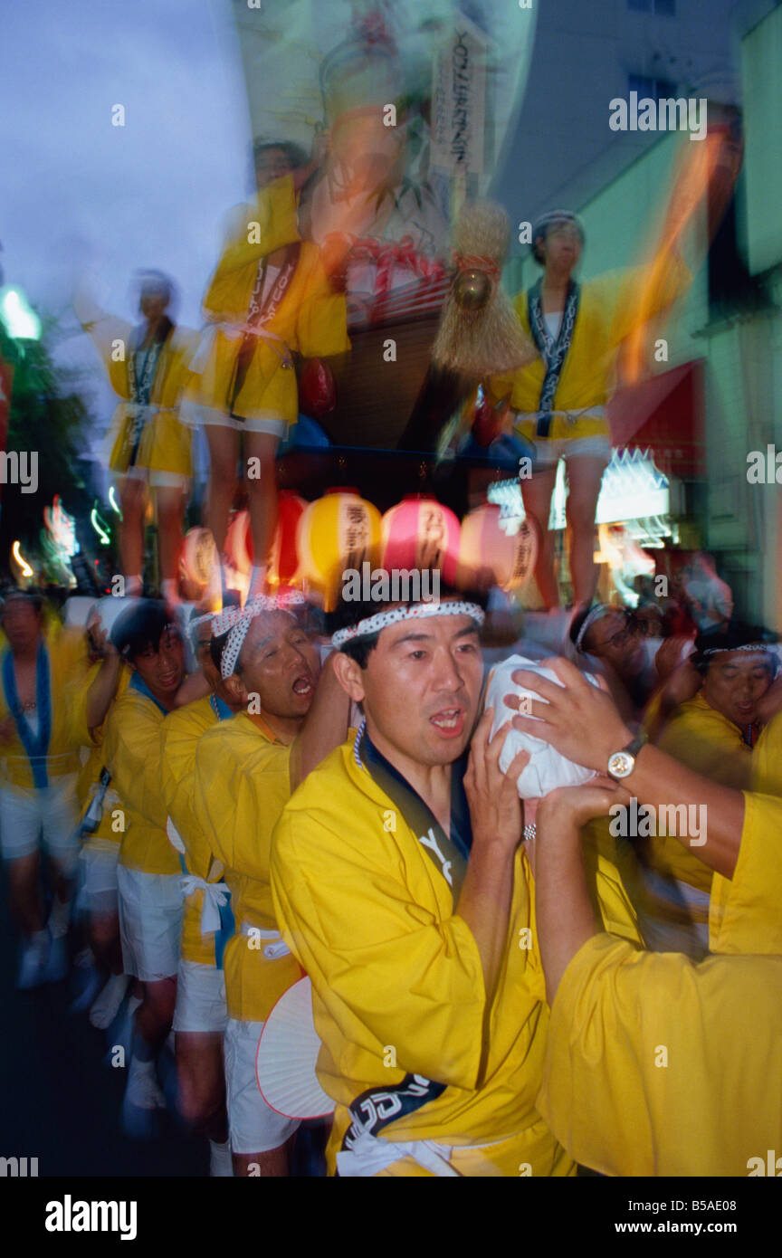 A group of men carrying a shrine during Mikoshi portable shrine ...