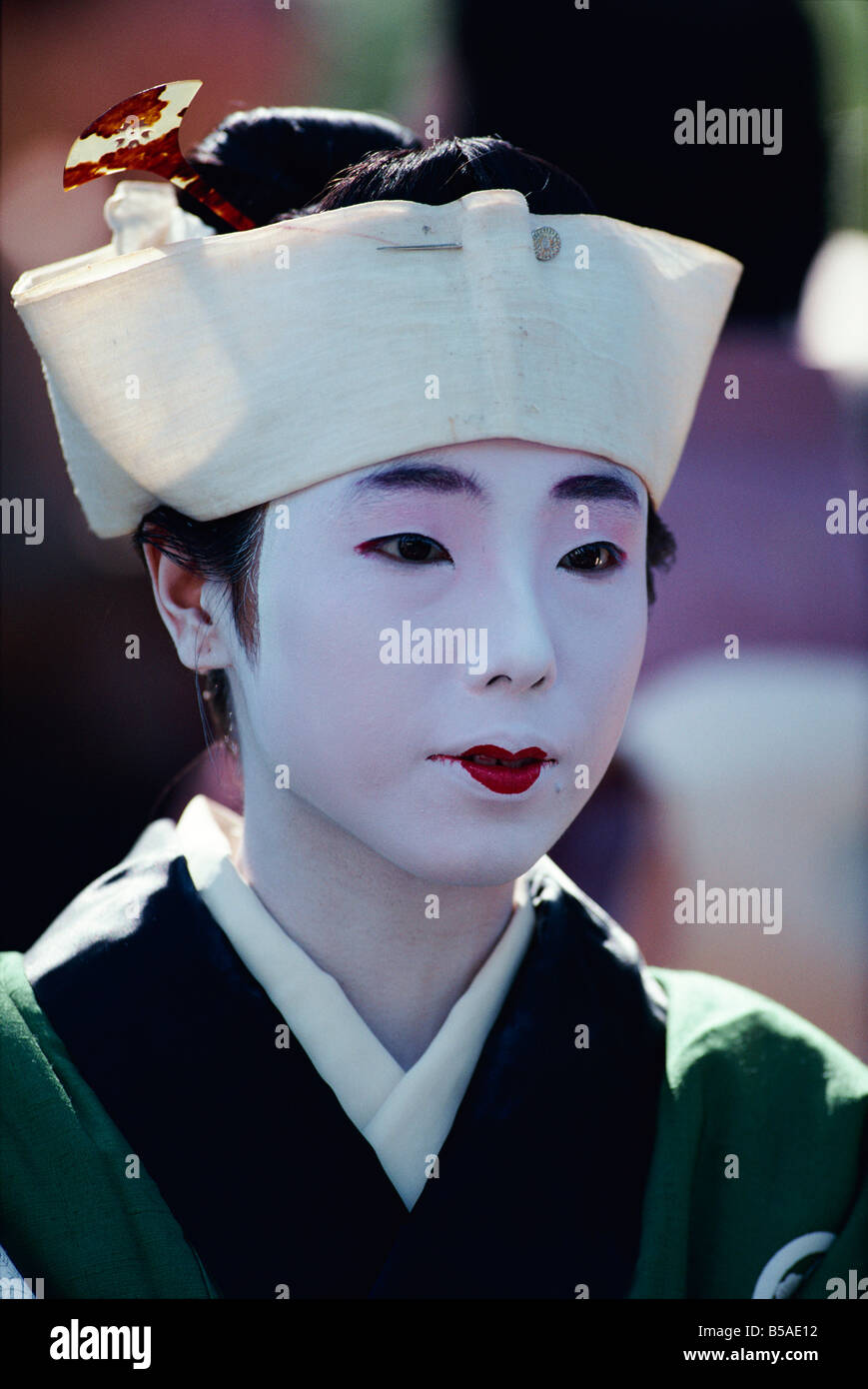 Portrait of a woman with white face make up and hat of the Heian period ...