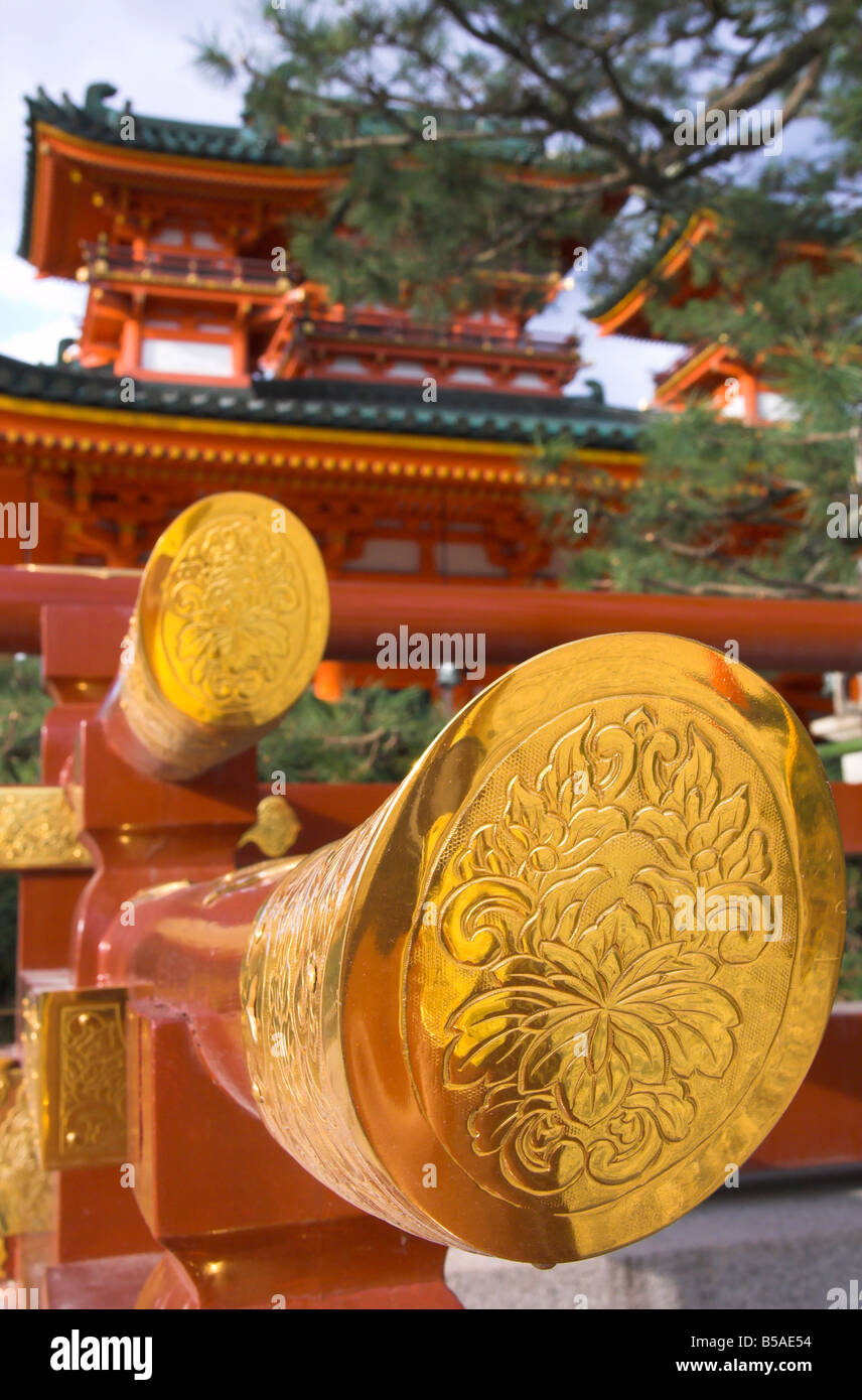 Close up of traditional painted wooden fence with temple in background ...