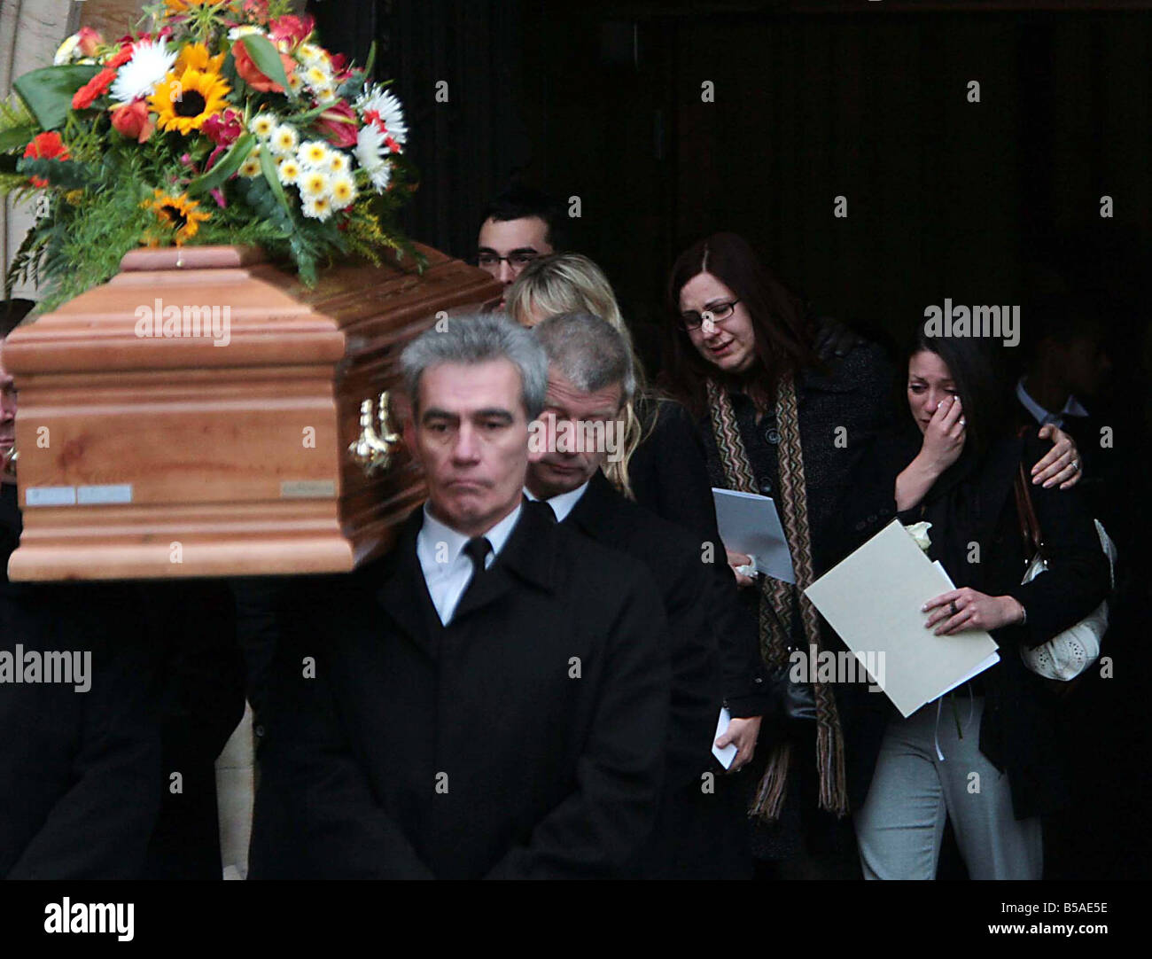The coffin of murdered student Meredith Kercher is followed out of ...
