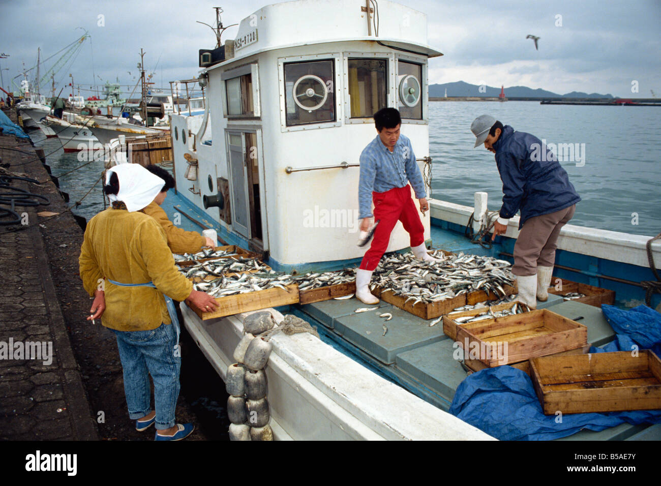 Fishermen selling their catch off the boat on Fukue Island, Nagasaki ...