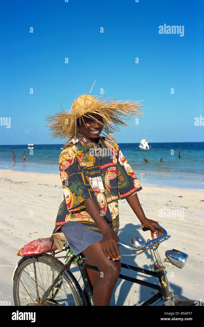 Cyclist with red snapper fish Nyali Beach Kenya East Africa Africa ...