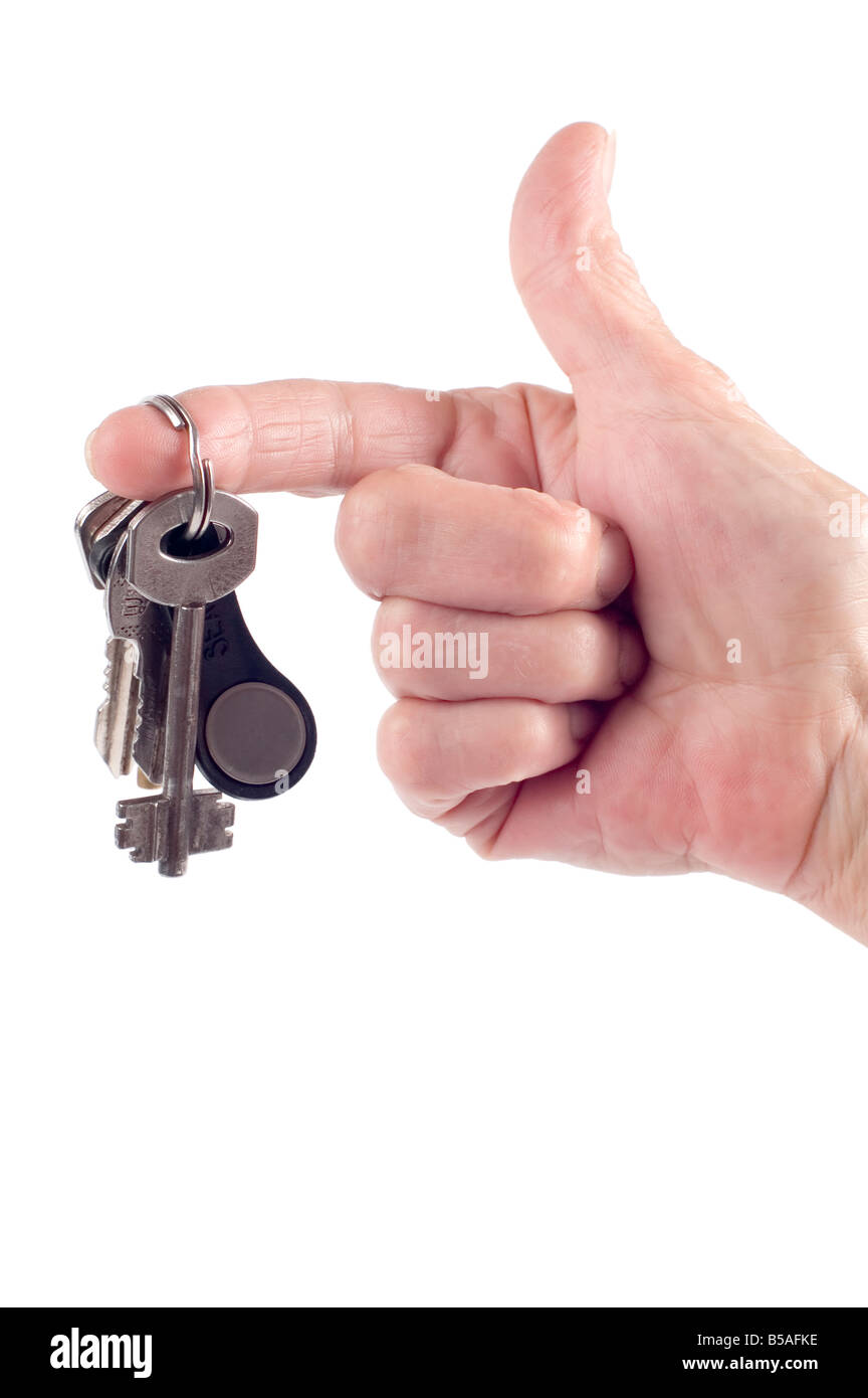 object on white Key on hand Stock Photo - Alamy