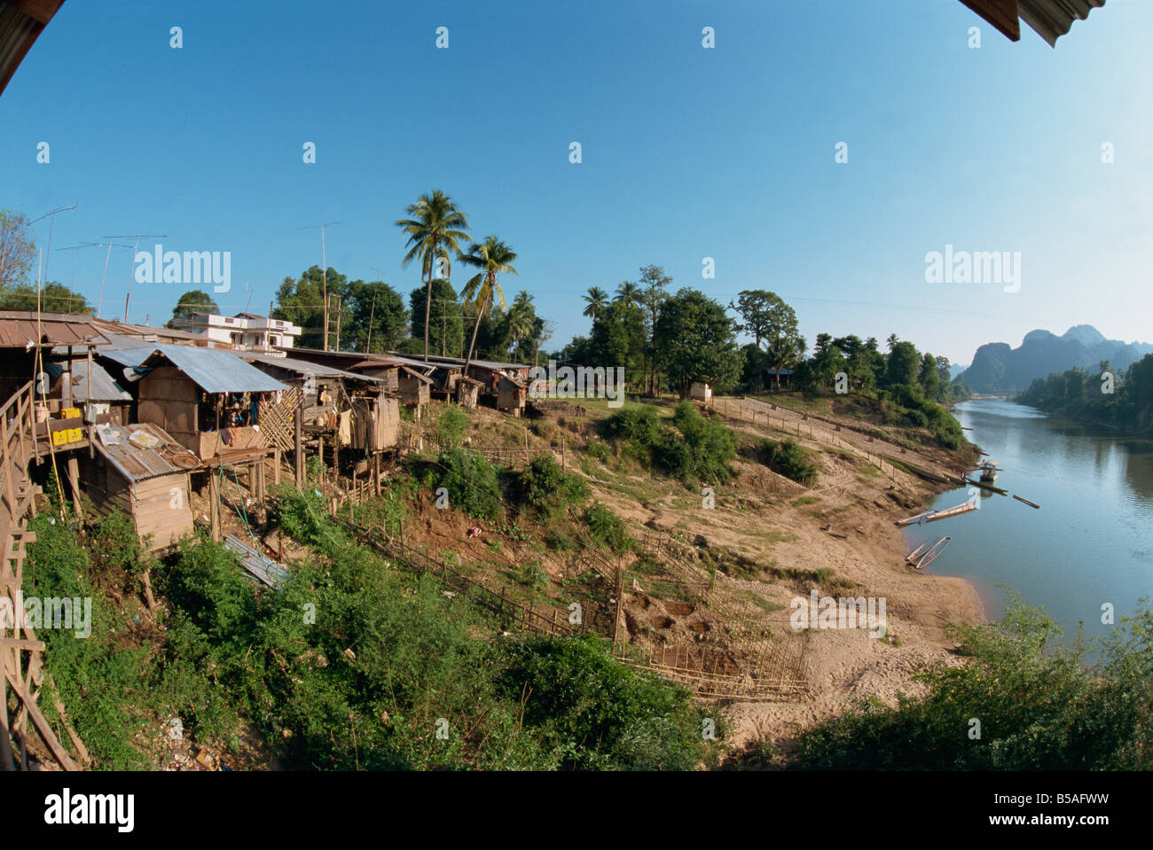 Stilt houses along the bank of the Xe Beng Fai River Mahaxai Khammouan province Laos Indochina ...