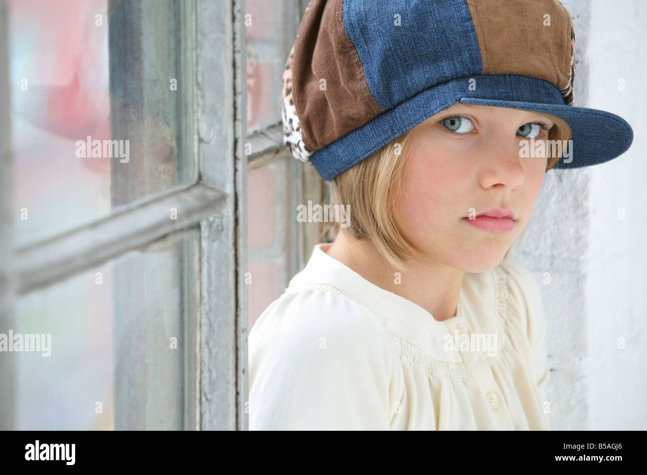 Portrait of young girl in cap Stock Photo - Alamy
