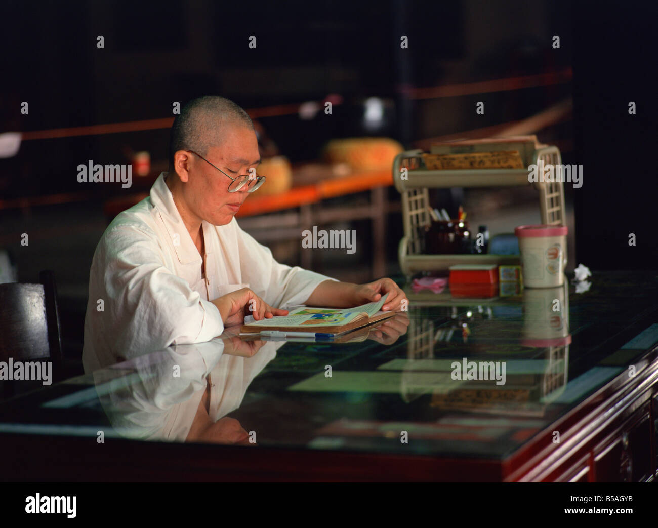 Buddhist nun studying Tokong Cheng Hoon Merciful Cloud Temple Melaka ...