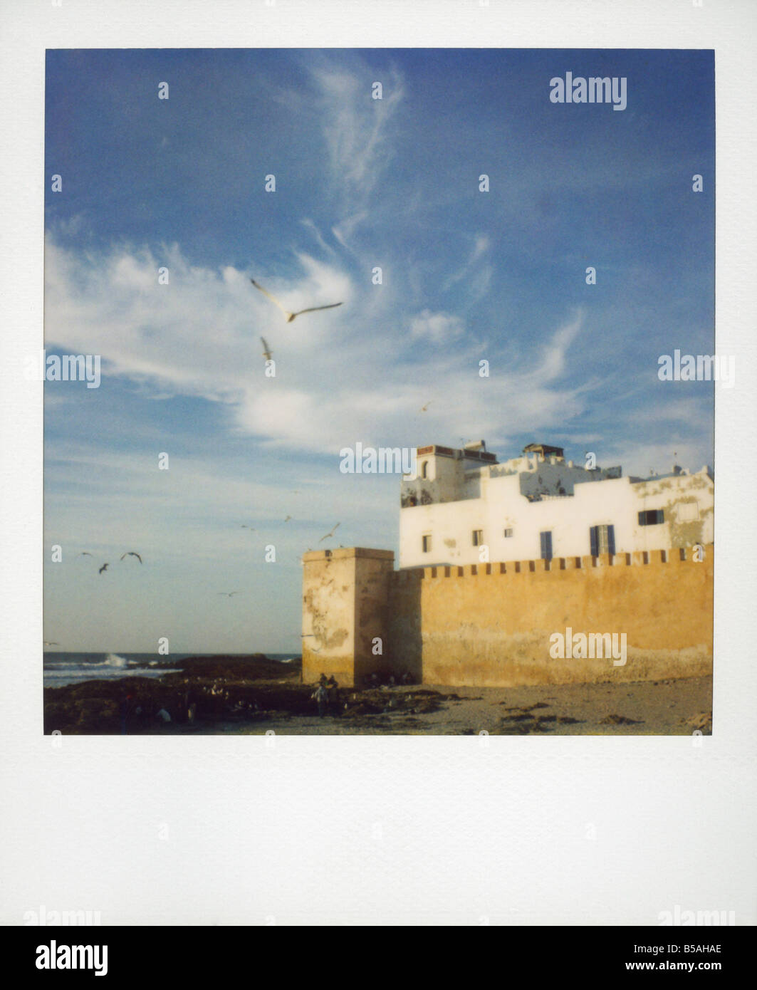 Polaroid image of old ramparts and whitewashed building overlooking ...