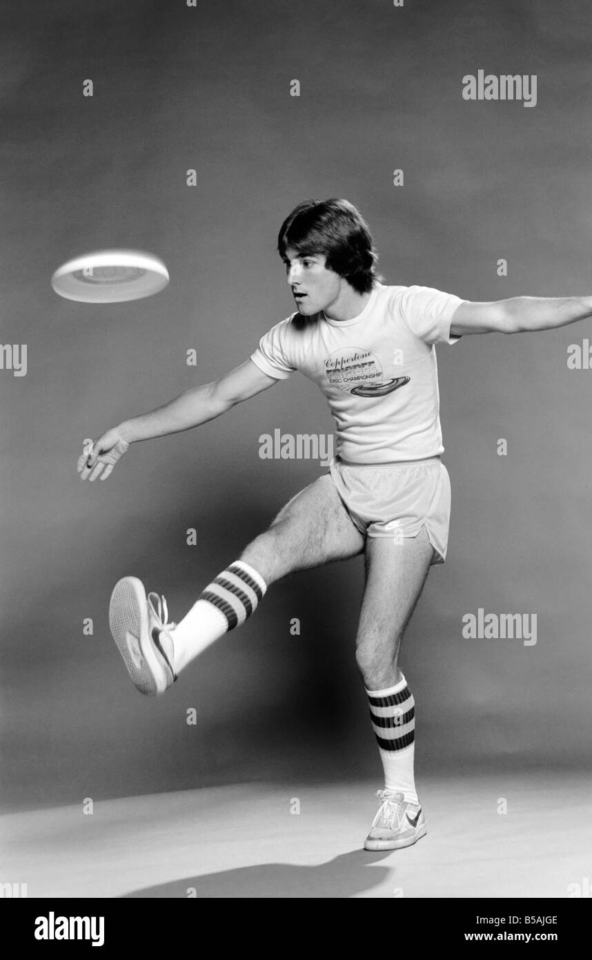 A man performing exercises with a frisbee. June 1980 Stock Photo - Alamy