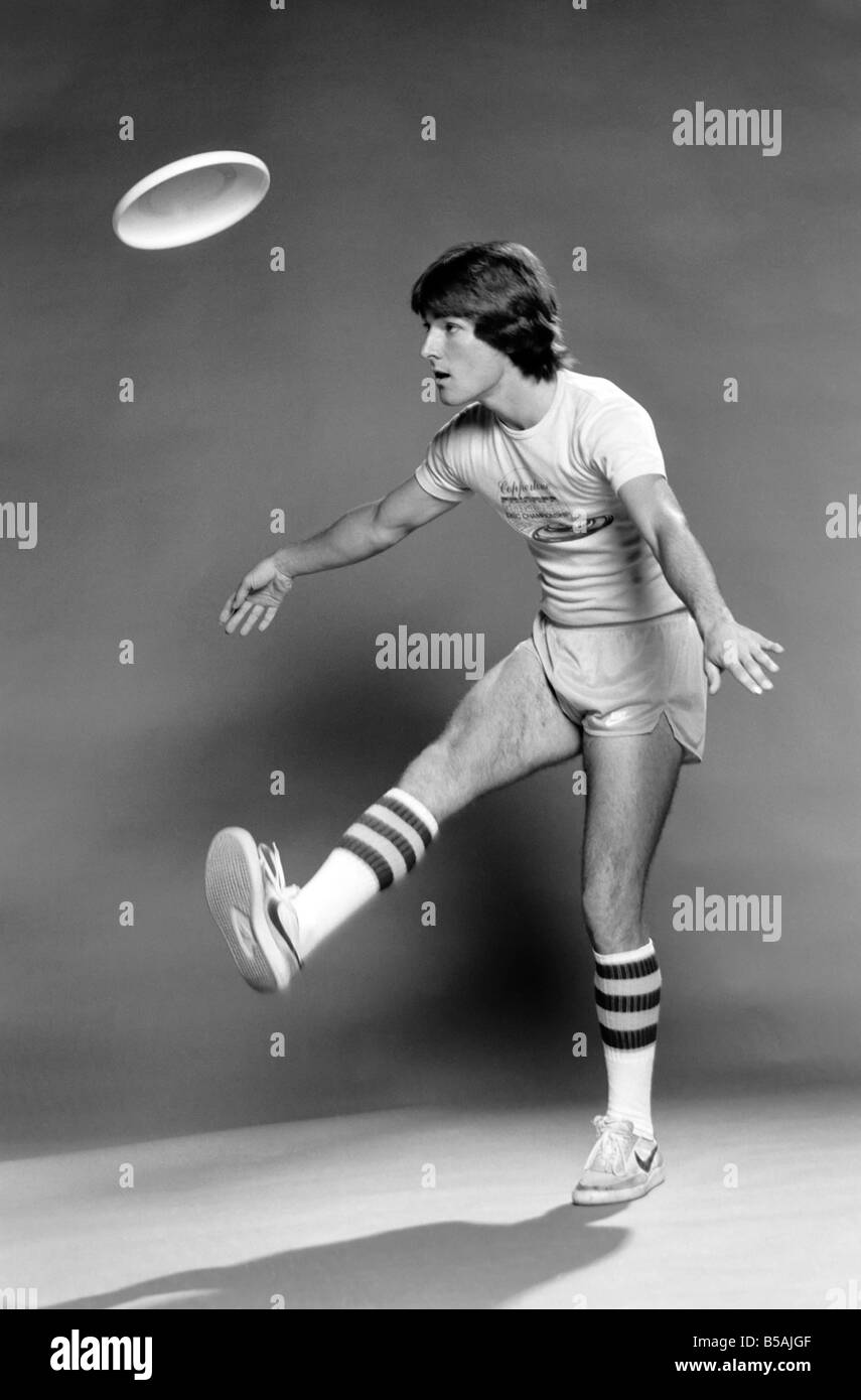 A man performing exercises with a frisbee. June 1980 Stock Photo - Alamy