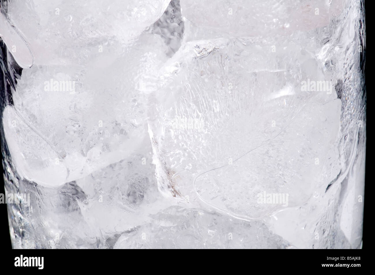 object on black Ice cubes in glass Stock Photo - Alamy