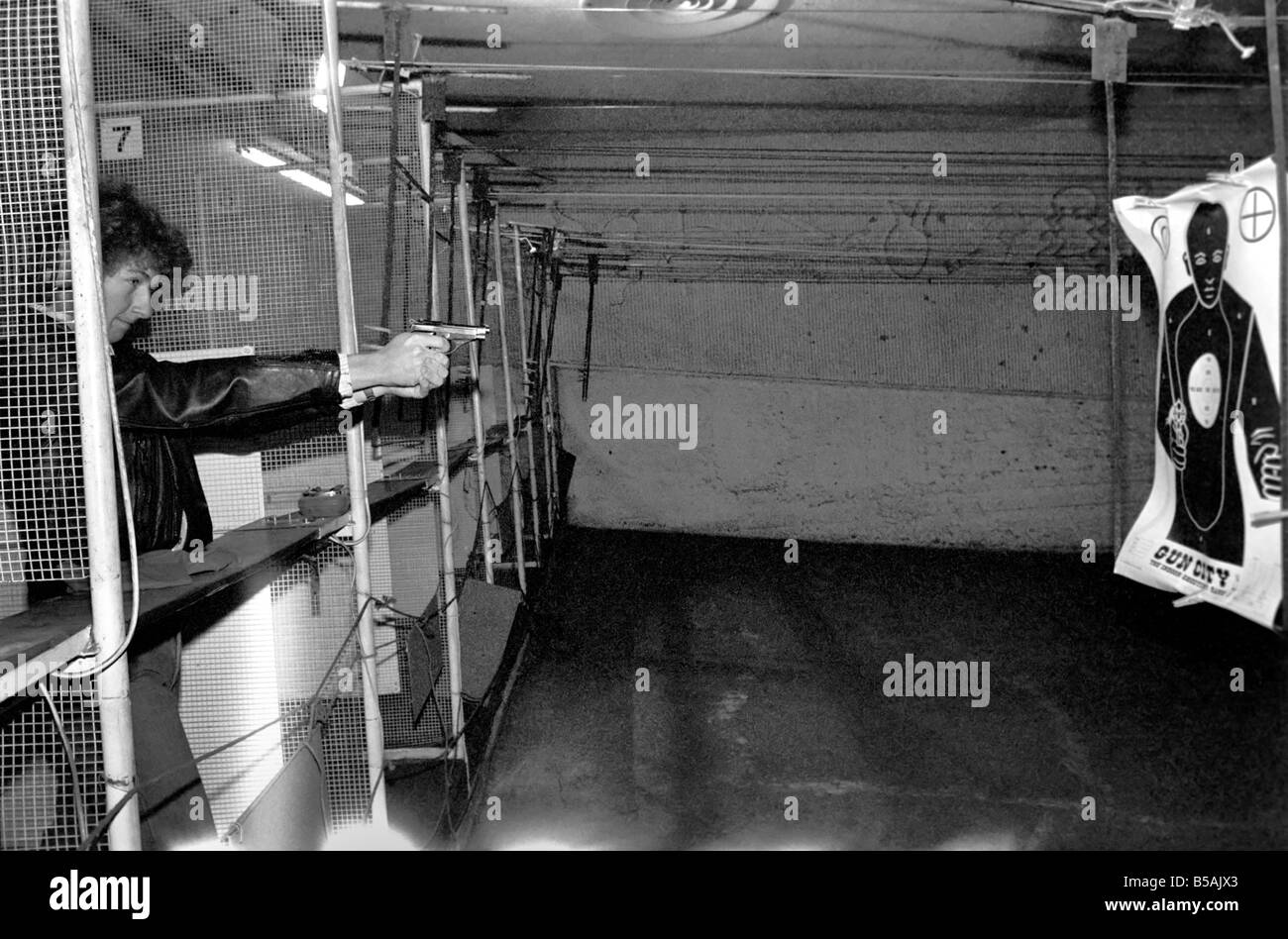 A man shooting at a target during practice at Gun City shooting range ...