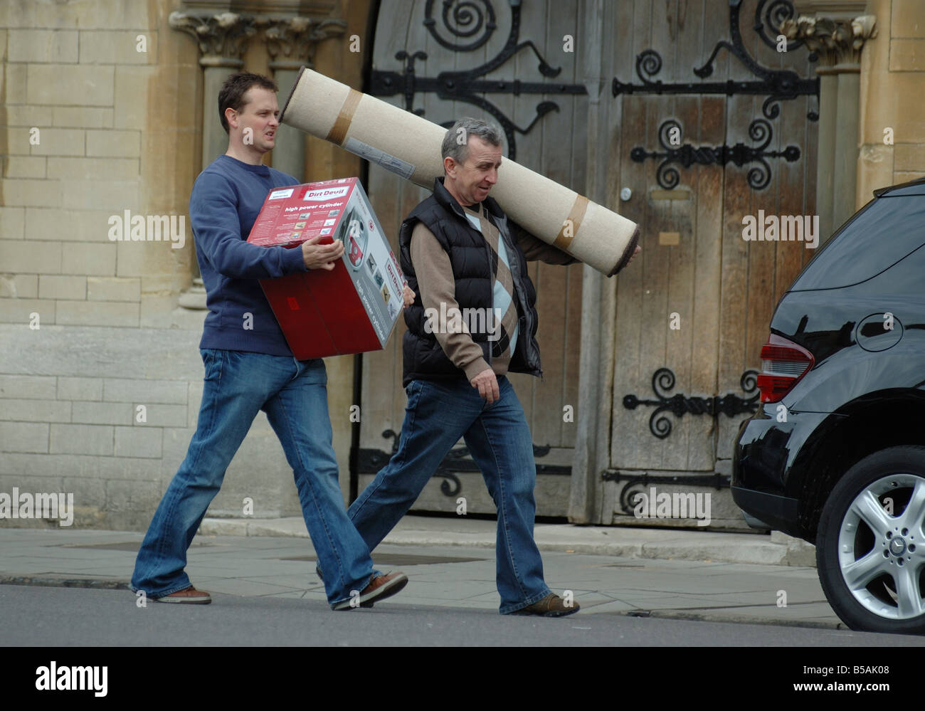 Man carrying a carpet Stock Photo - Alamy