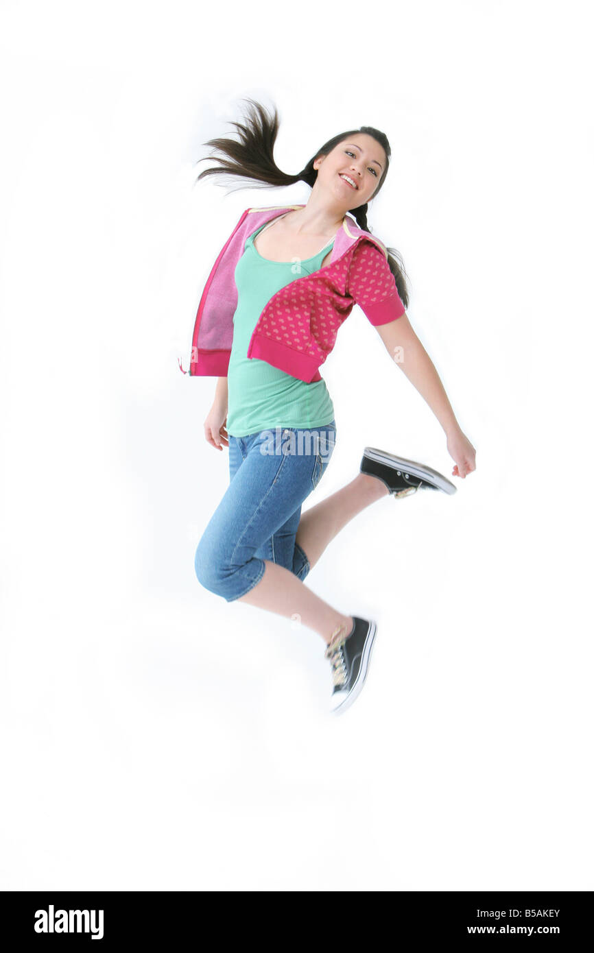 Teenage girl in mid jump Stock Photo - Alamy