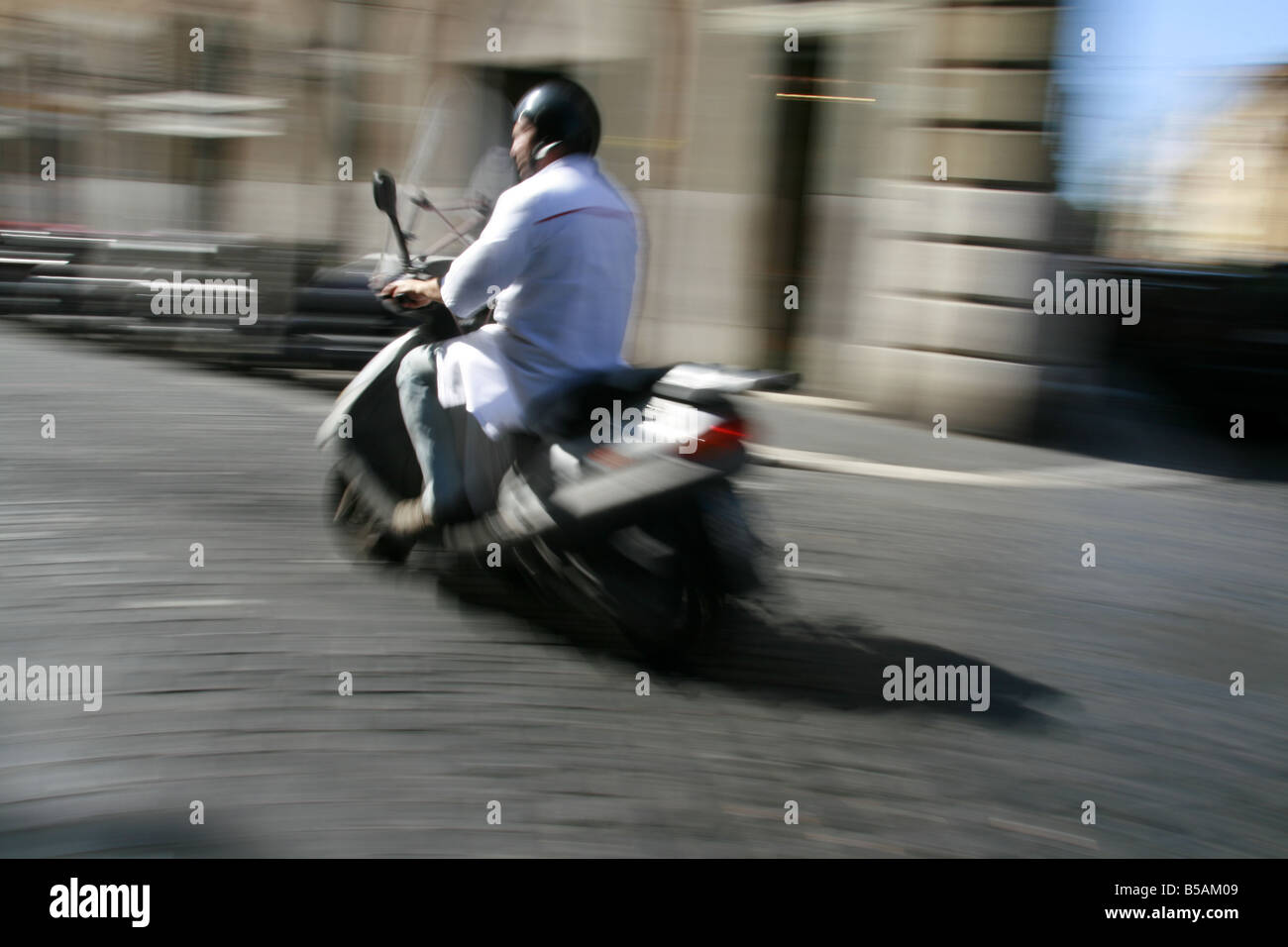 Person riding moped hi-res stock photography and images - Alamy