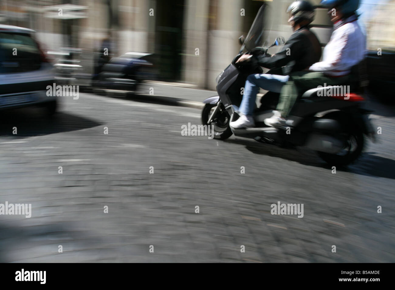Riding scooter moped in rome hi-res stock photography and images - Alamy