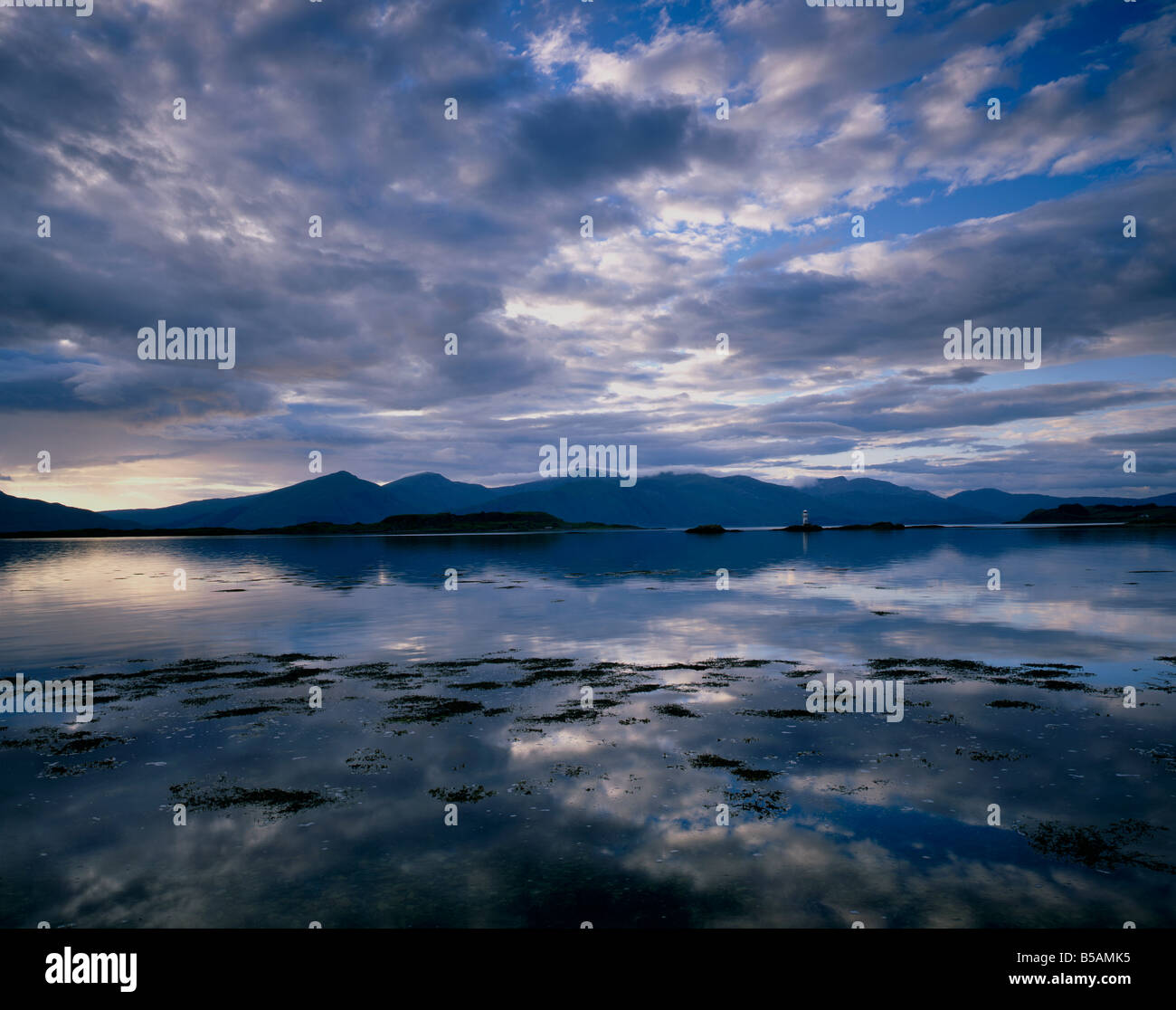 A perfect reflection over Loch Linnhe to the mountains of Morvern and ...