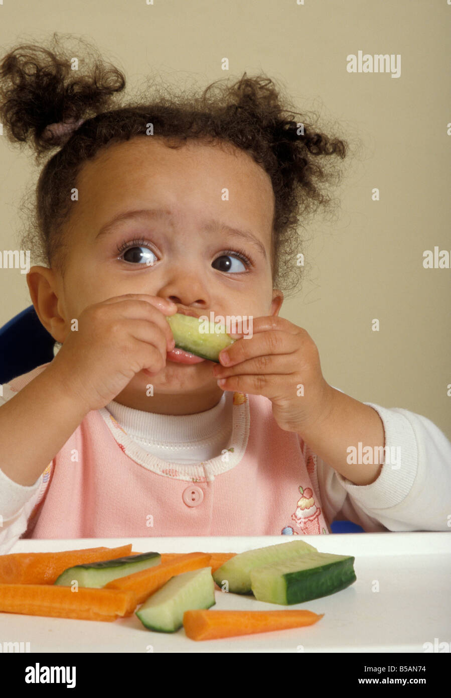 Ethnic baby eating vegetables hi-res stock photography and images - Alamy