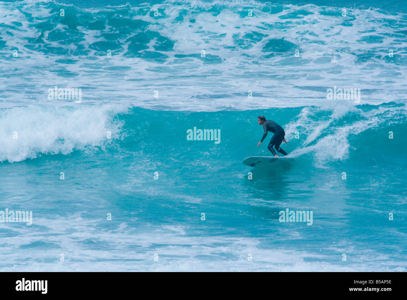 Surfer riding wave Stock Photo - Alamy