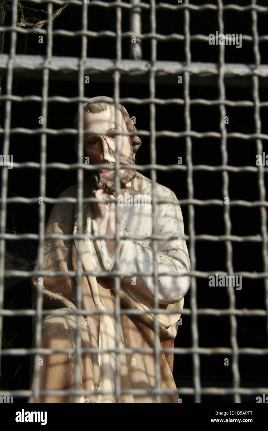 religious man statue at road side altar in italy Stock Photo - Alamy